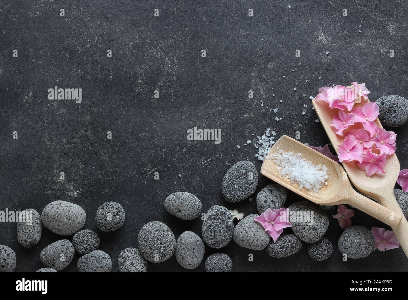 dark Spa background with pebbles and flowers Stock Photo - Alamy