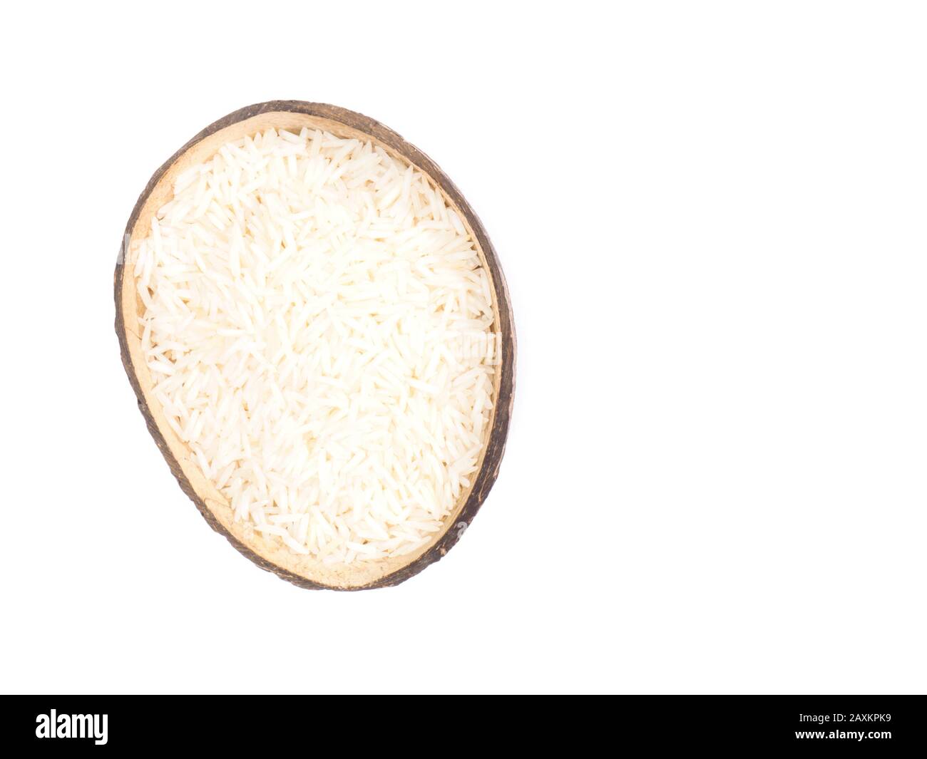 Indian long grain Basmati rice in half coconut shell isolated on white ...