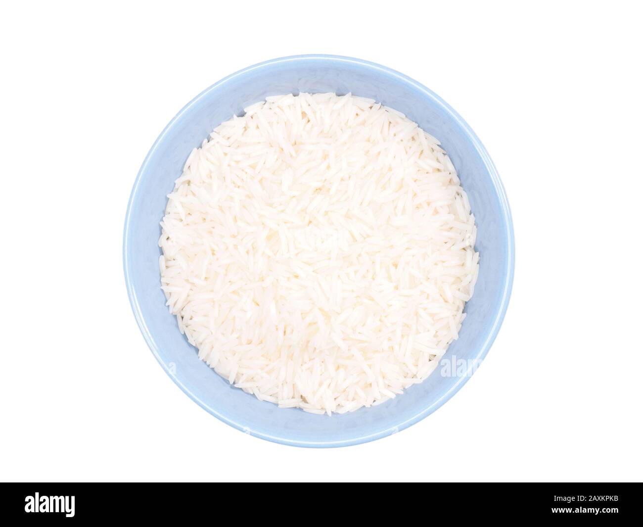 Indian long grain Basmati rice in blue ceramic bowl isolated on white ...