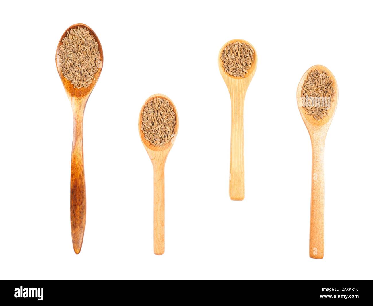 Set of spice cumin (jeera) in wooden spoon isolated on white Stock ...