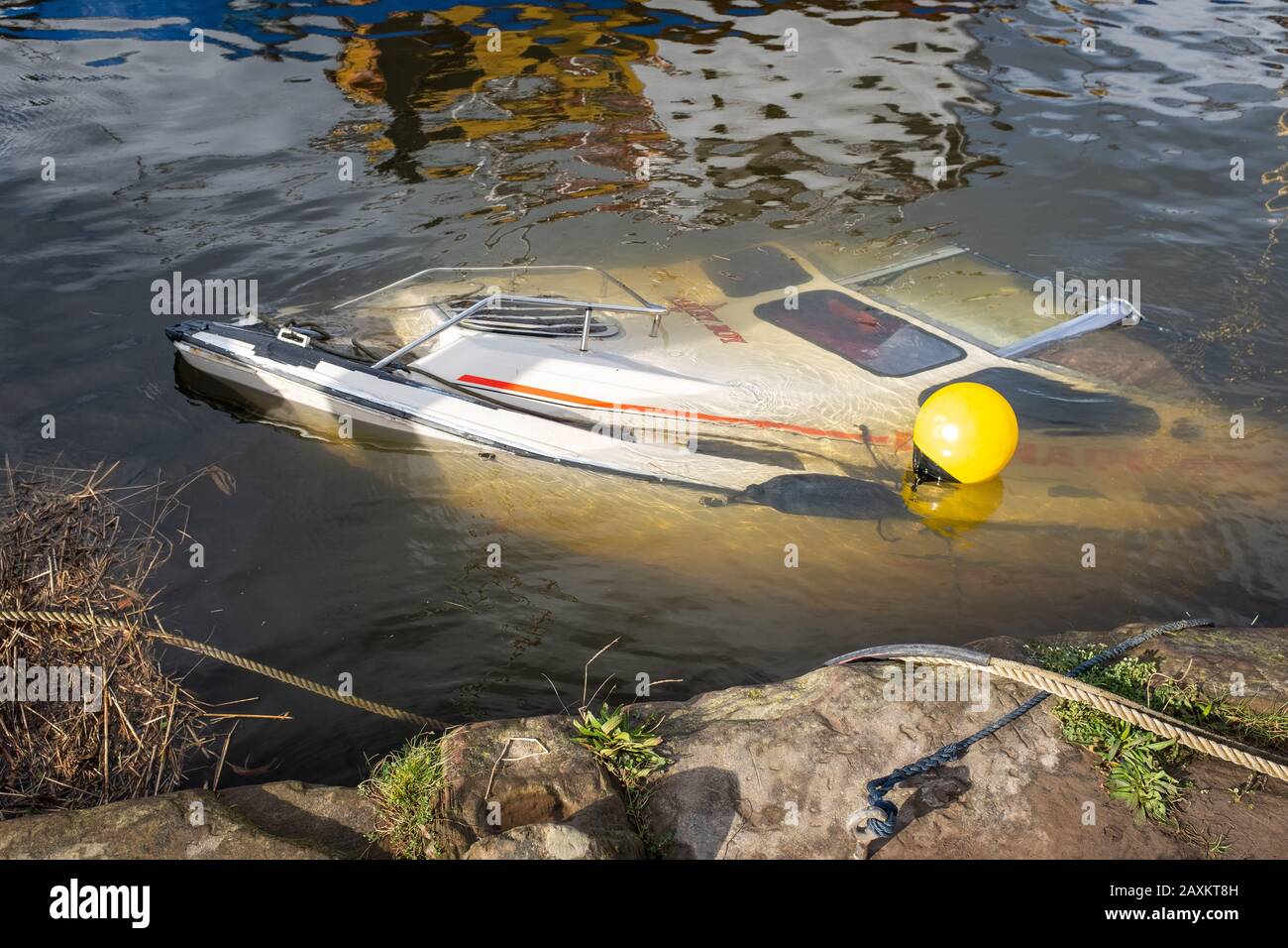 Small sunken boat at Kingholm Quay harbour, Scotland. Possibly due to ...