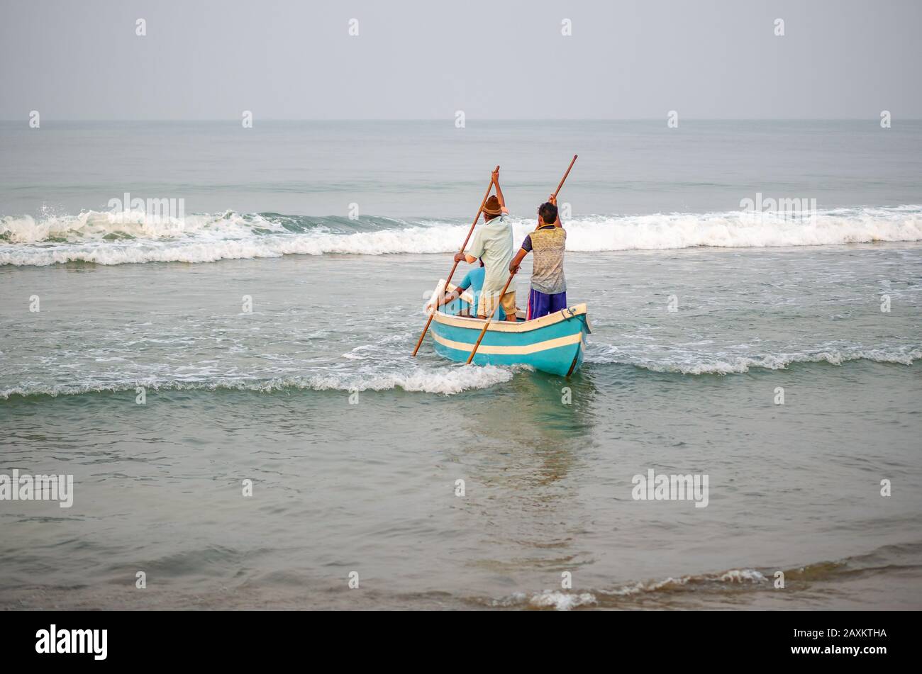 Fishermen using Traditional indian fishing boat at the beach of ...