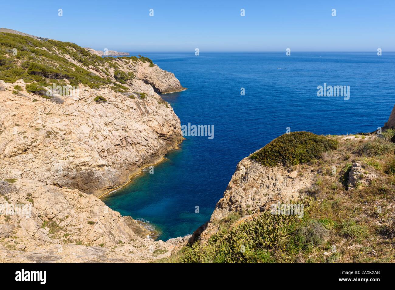Rocky coast with blue sea. North-east coast of Majorca. Spain Stock ...