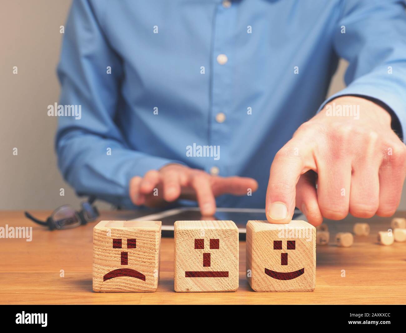 Business concept with small wooden blocks on an office table, rating or ...