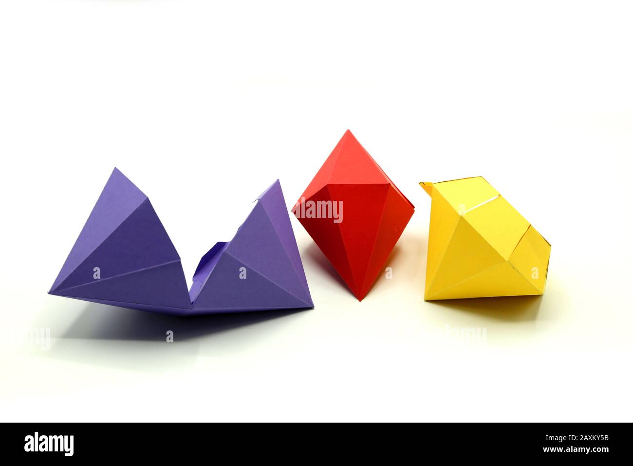 Geometric shapes cut out of colored paper and photographed from above ...