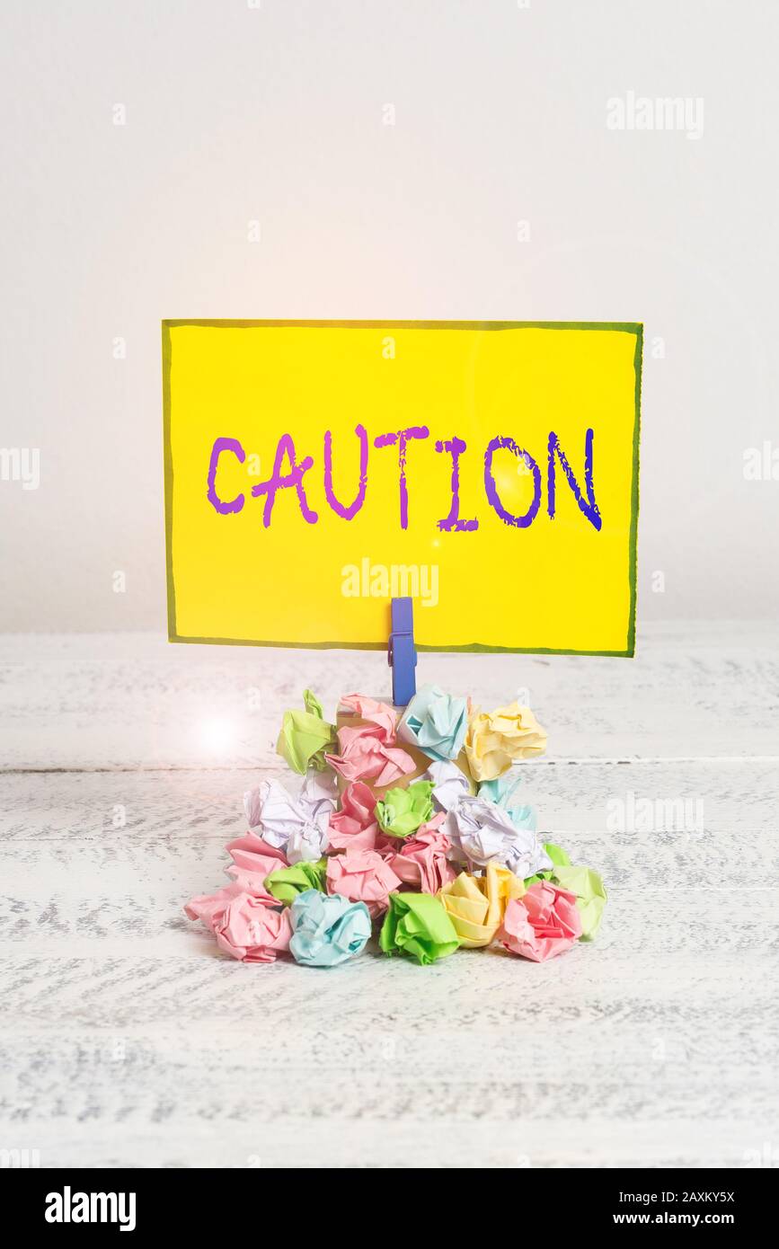 Writing note showing Caution. Business concept for Care taken to avoid ...