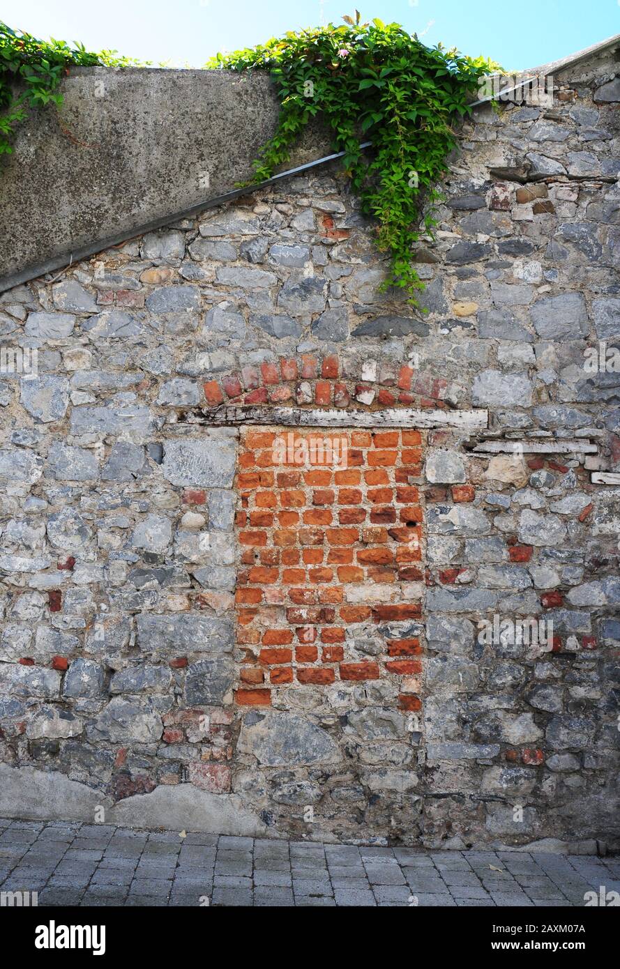 Bricked up doorway in an old wall in Kilkenny Stock Photo - Alamy