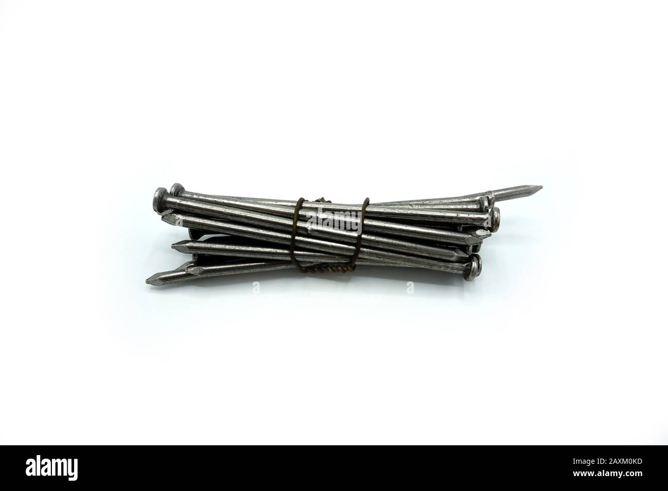 Steel construction nails of different lengths tied together in groups ...