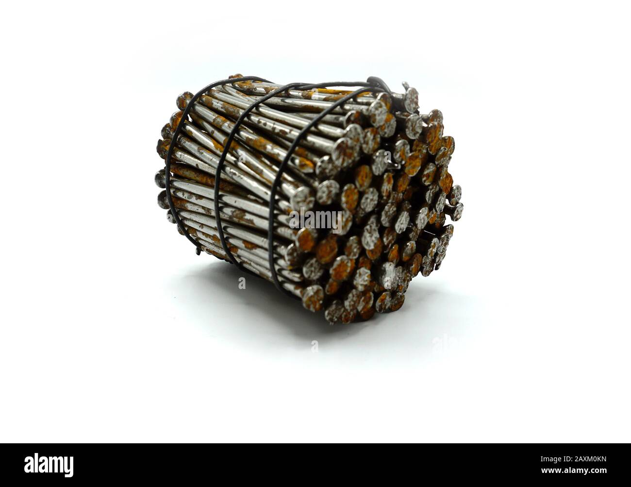 Steel construction nails of different lengths tied together in groups ...