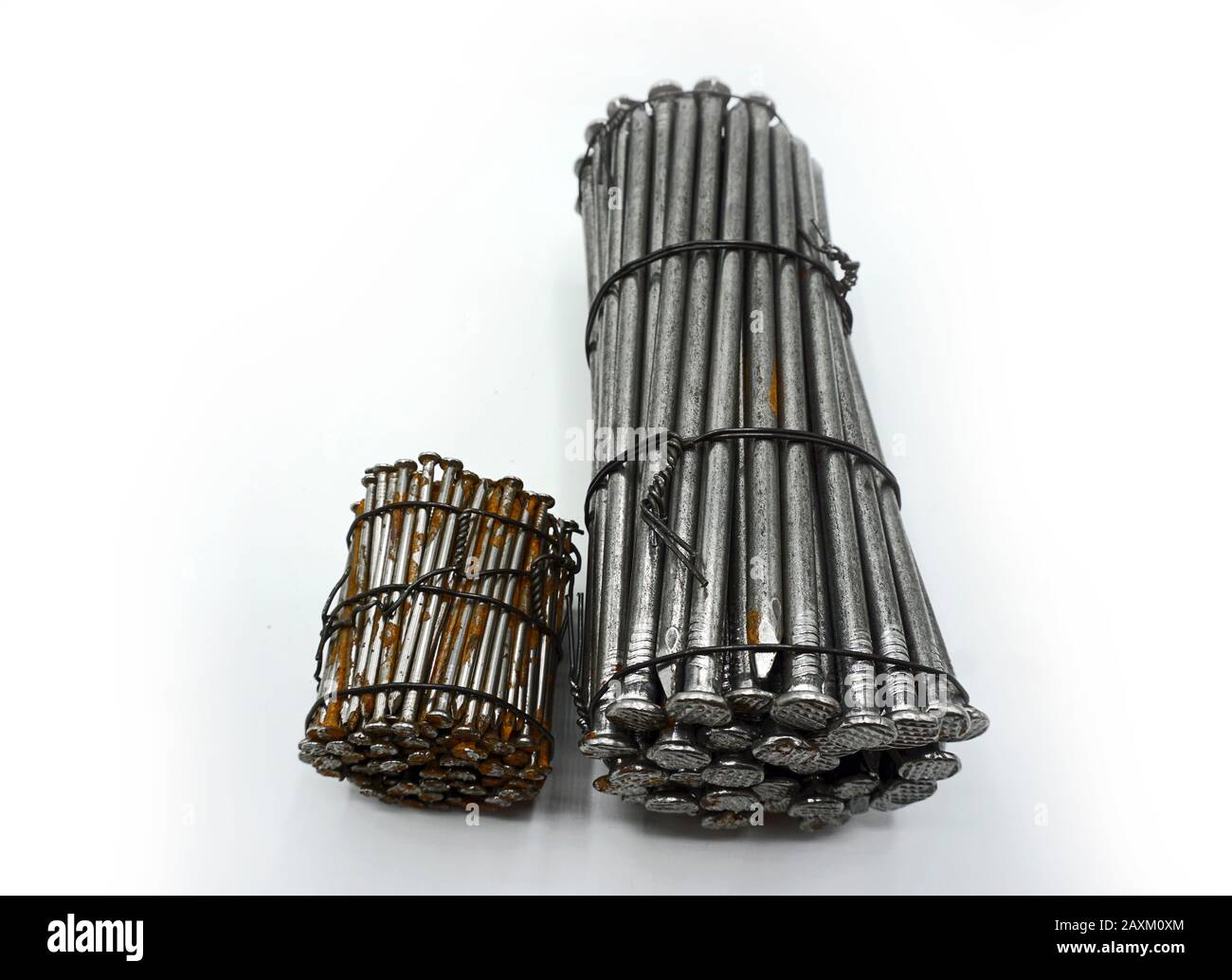 Steel construction nails of different lengths tied together in groups ...