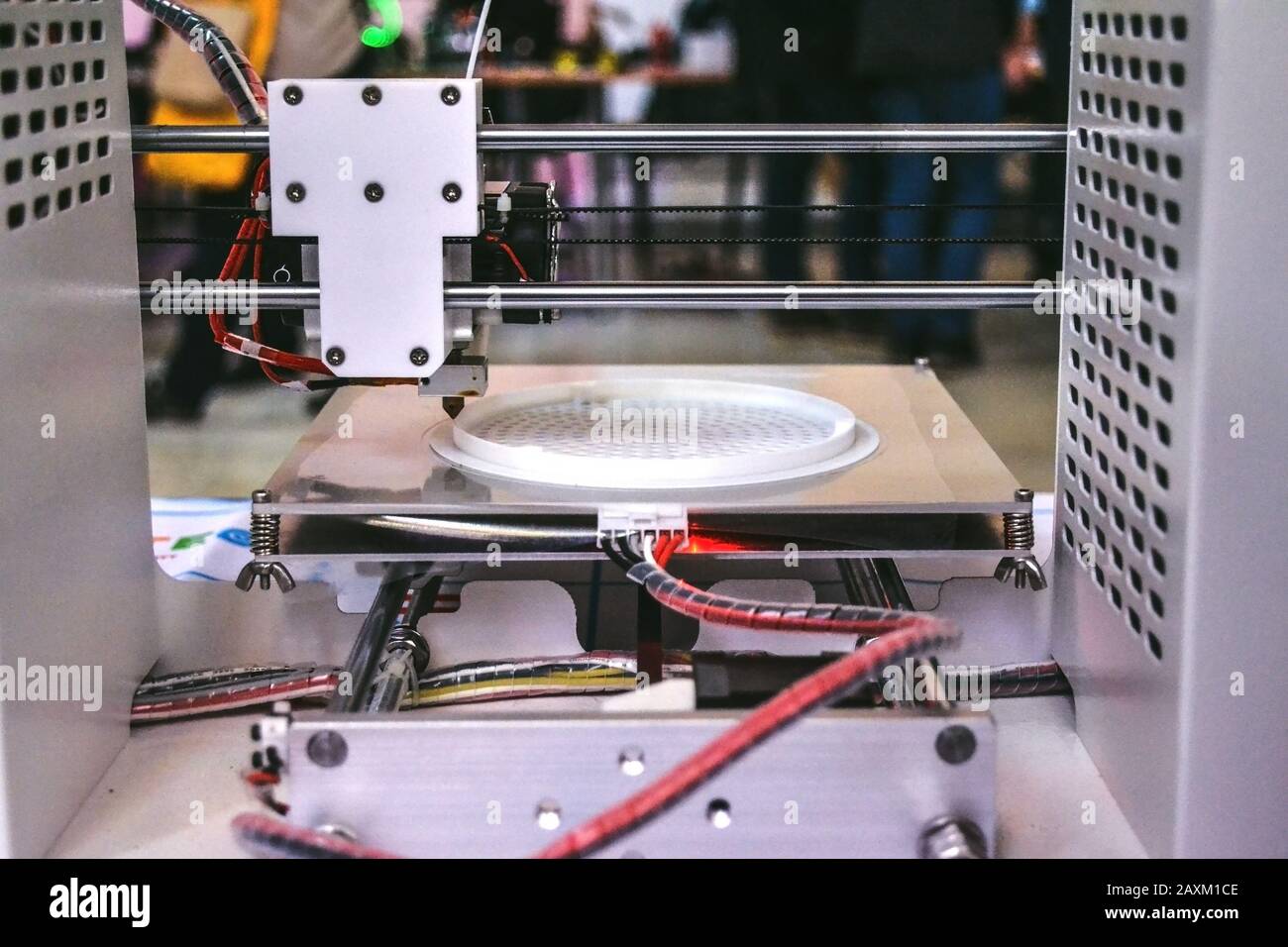 The process of working 3D printer and creating a three-dimensional object. Progressive modern ...