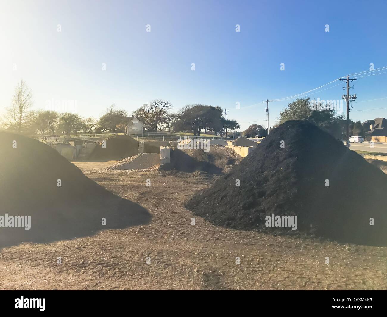 Pile of organic compost at green waste recycling wholesale plant near ...