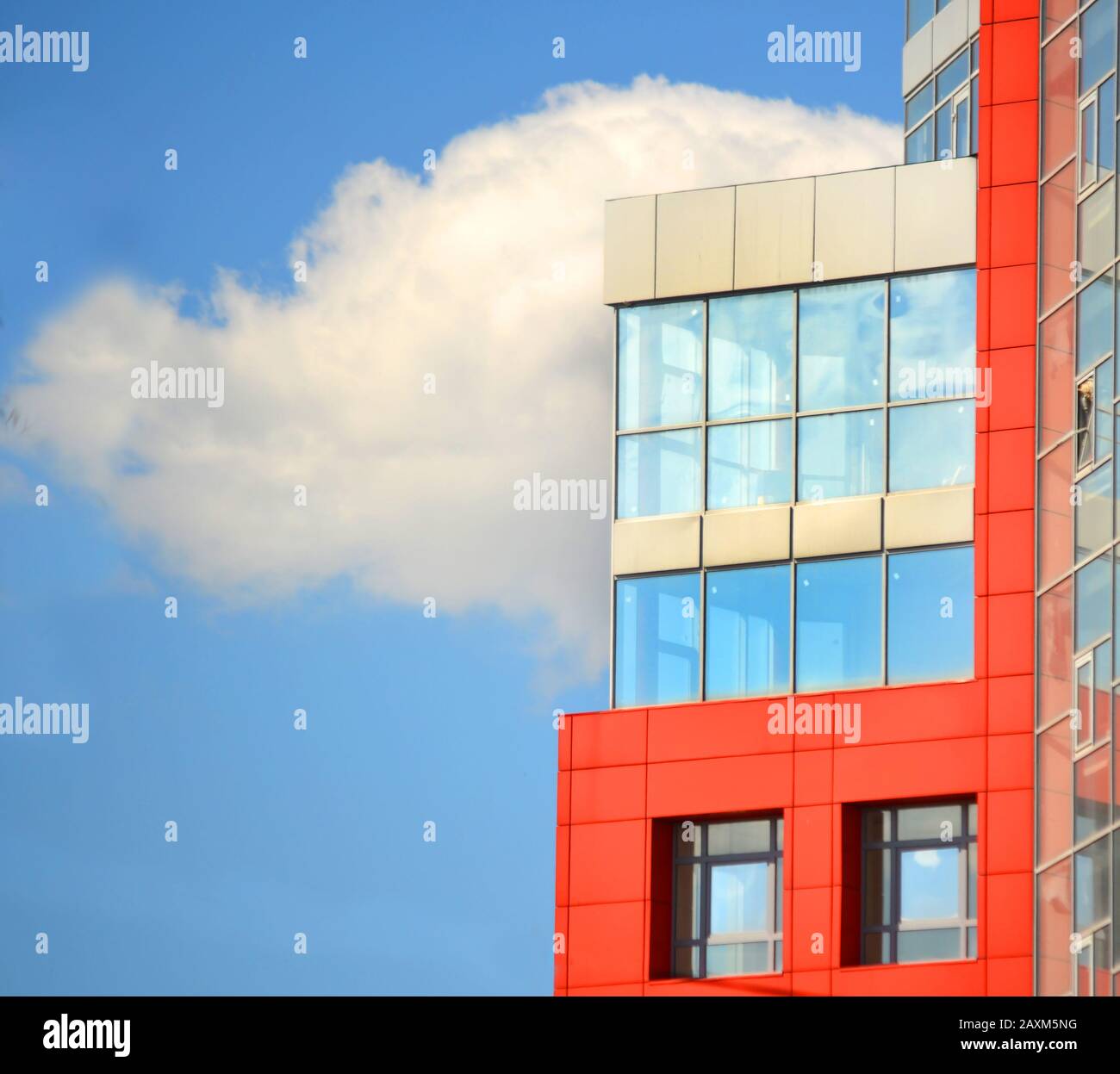 modern building with a red square windows and mirrored glass on the ...