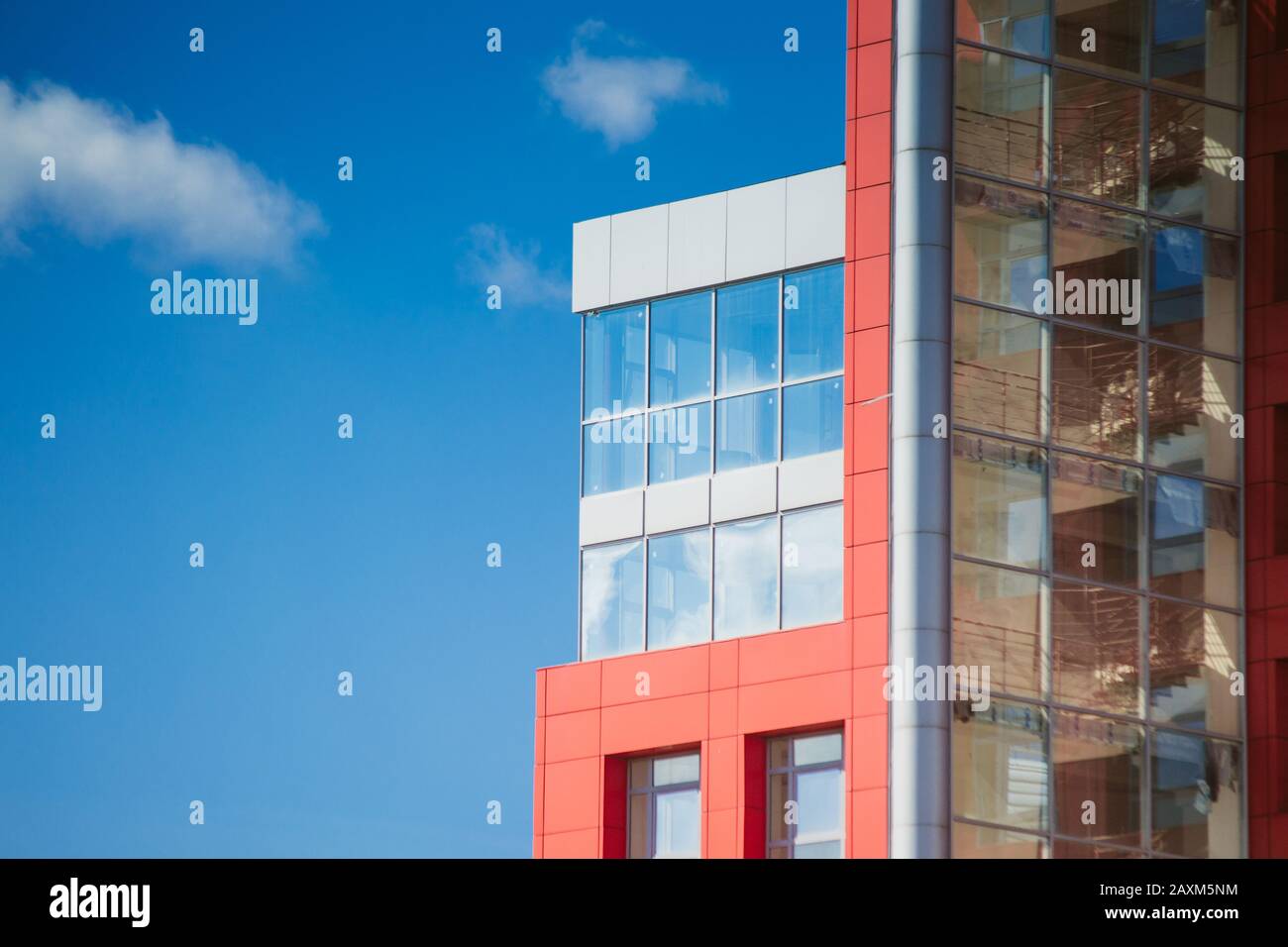 modern building with a red square windows and mirrored glass on the ...