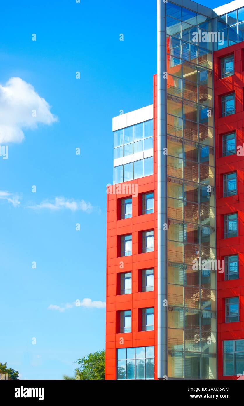modern building with a red square windows and mirrored glass on the ...