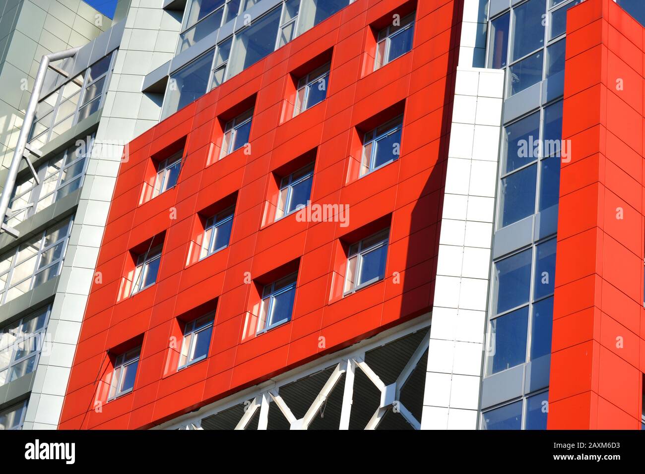 Red, blue color walls of a modern building. Part of the facade of the ...