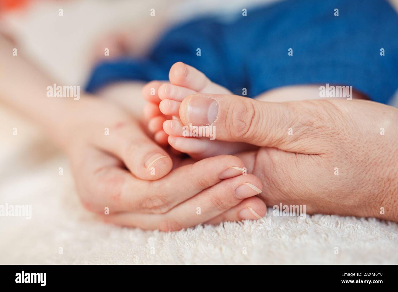 Close up photo of a baby foot in mother hands Stock Photo - Alamy