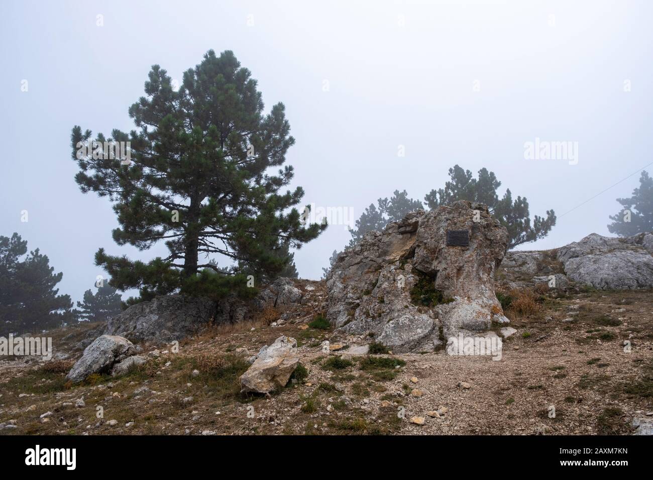Rock on Ai-Petri with a memorial sign in honor of the caver Alexander ...