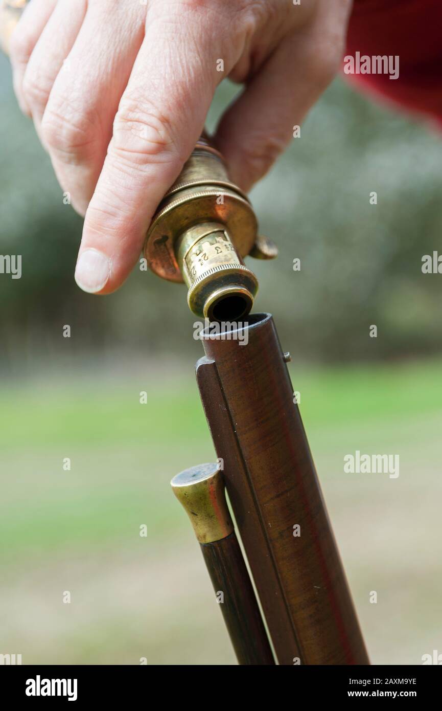 A man loading an antique black powder muzzle loading shotgun on a game ...