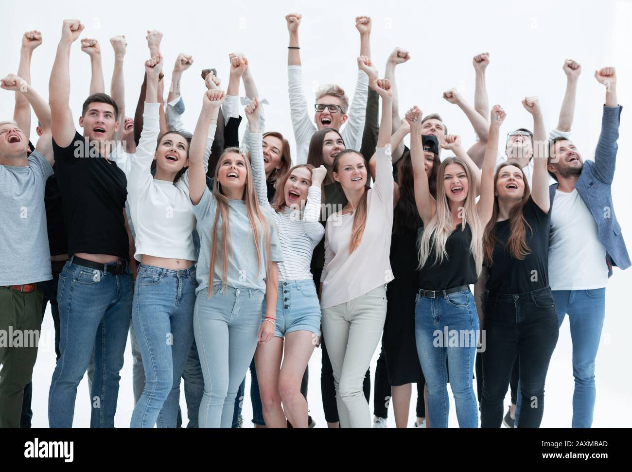 happy group of young people with hands up Stock Photo - Alamy