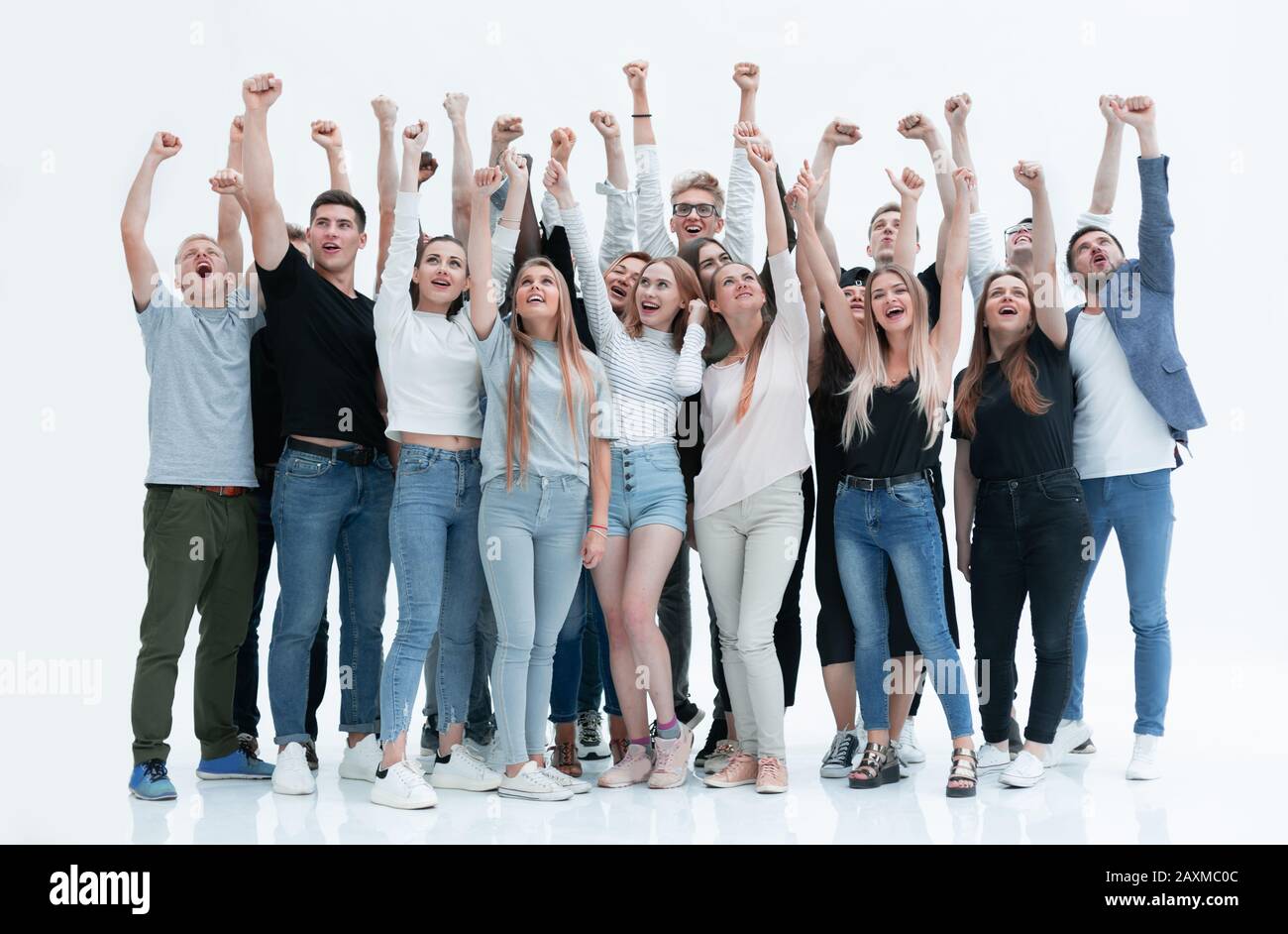 happy group of young people with hands up Stock Photo - Alamy