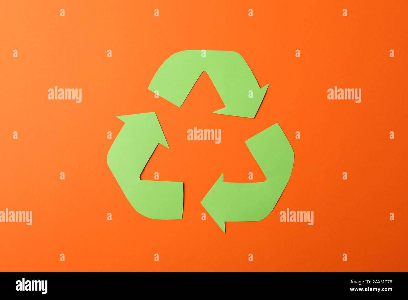 Recycling sign on orange background, top view Stock Photo - Alamy