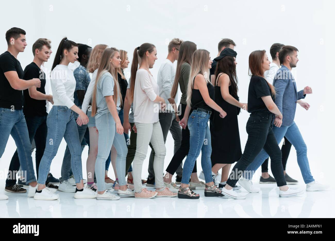 side view. a group of diverse young people standing in a row Stock ...