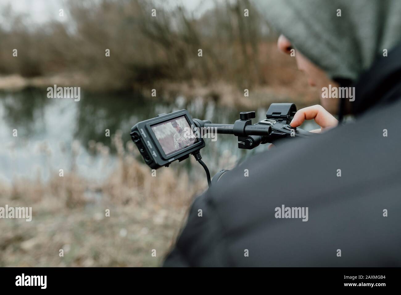 Camerman is holding the camera and recording Stock Photo - Alamy
