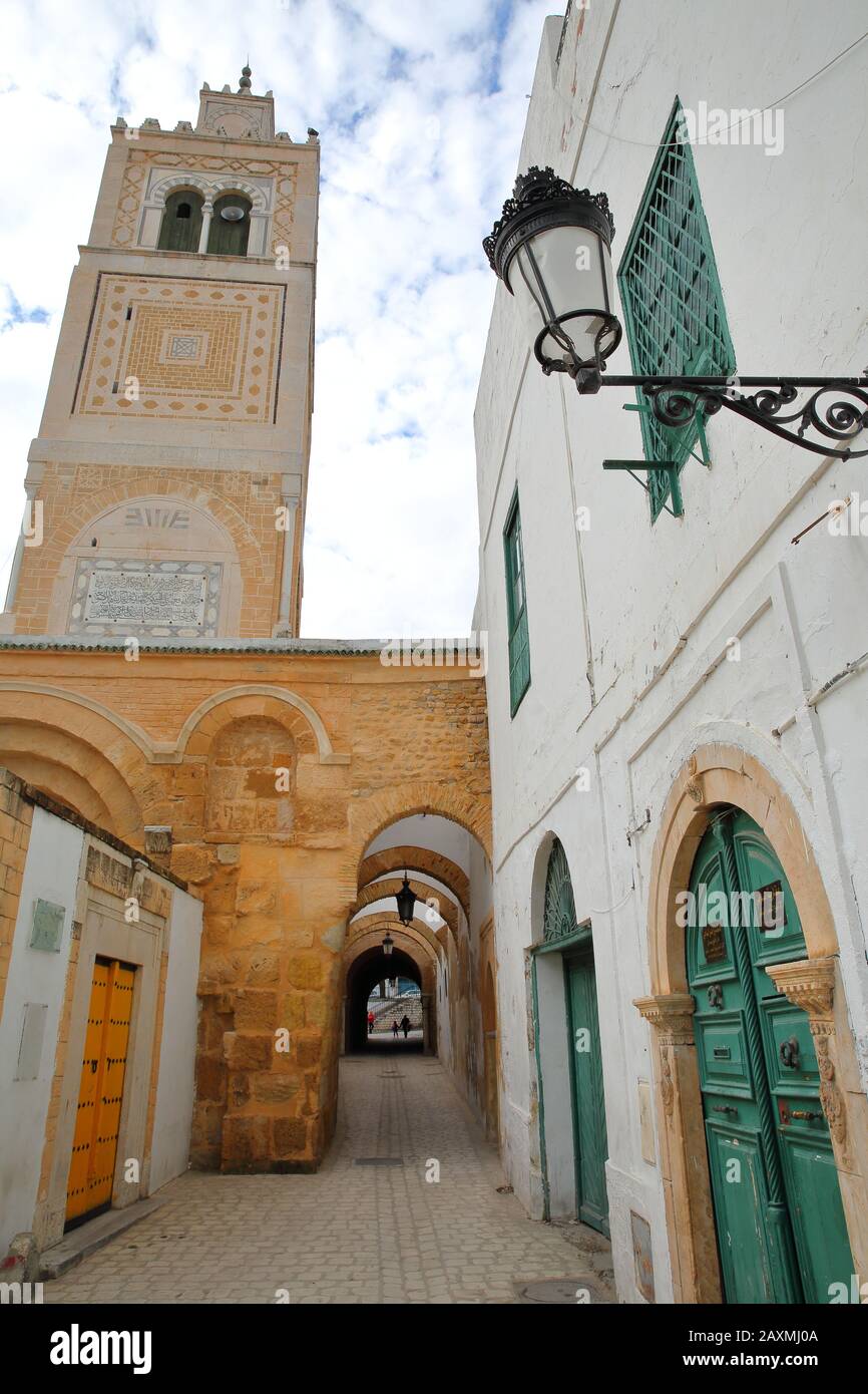 Typical cobbled and narrow street (Chateau street) with colorful doors ...