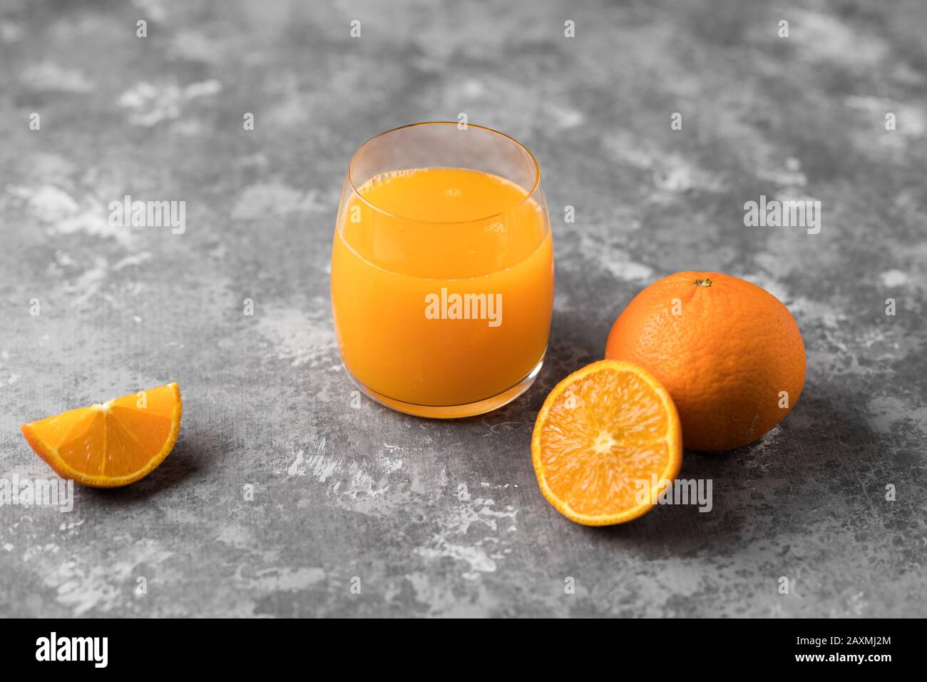 A freshly squeezed orange juice in a clear glass Stock Photo - Alamy