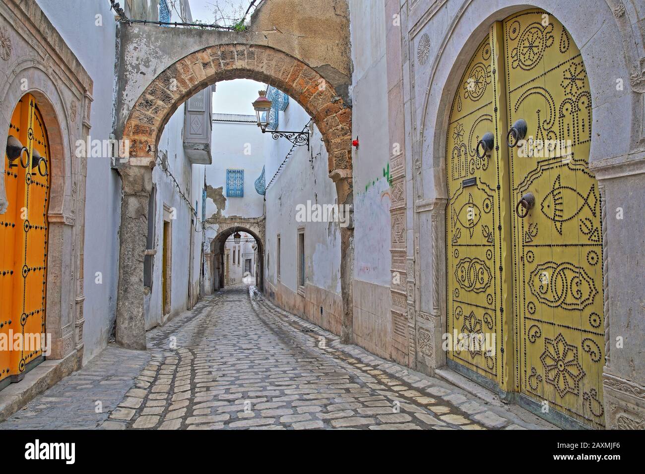 Typical cobbled and narrow street (Dar el Jeld street) with colorful ...