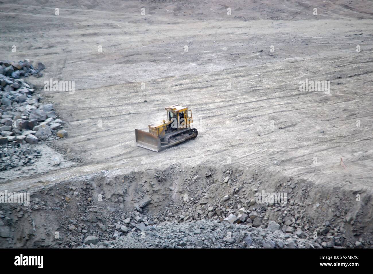 Tractor on the site of a granite quarry. view from aboveiew from above ...