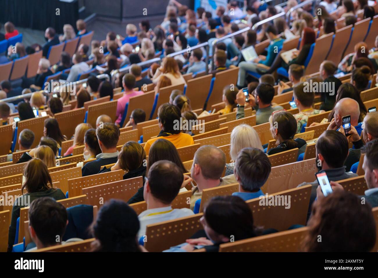 Business conference attendees sit and listen Stock Photo - Alamy