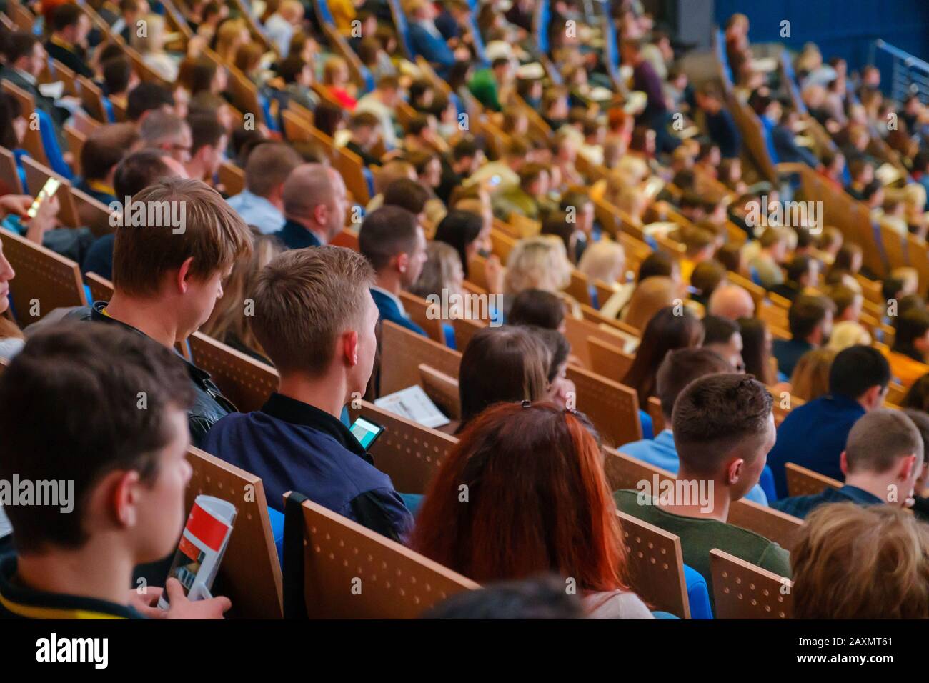 Business conference attendees sit and listen Stock Photo - Alamy