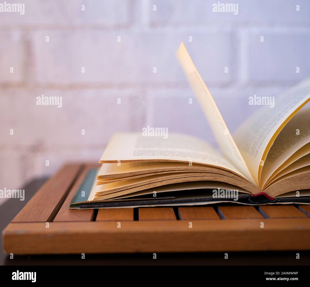 Open book turning the pages on a white background. Book concept Stock ...