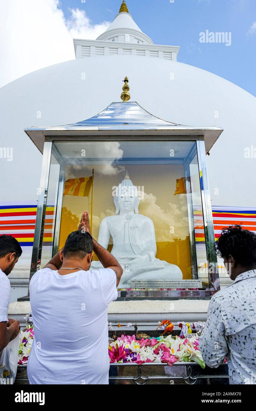 Kataragama, Sri Lanka - January 2020: Pilgrims making offerings in the ...