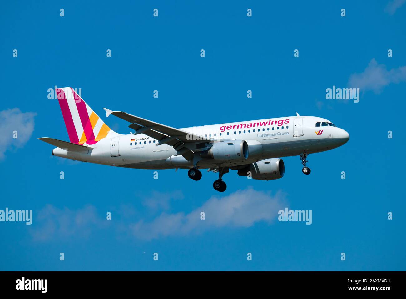 Colorful aircraft in blue sky Stock Photo - Alamy