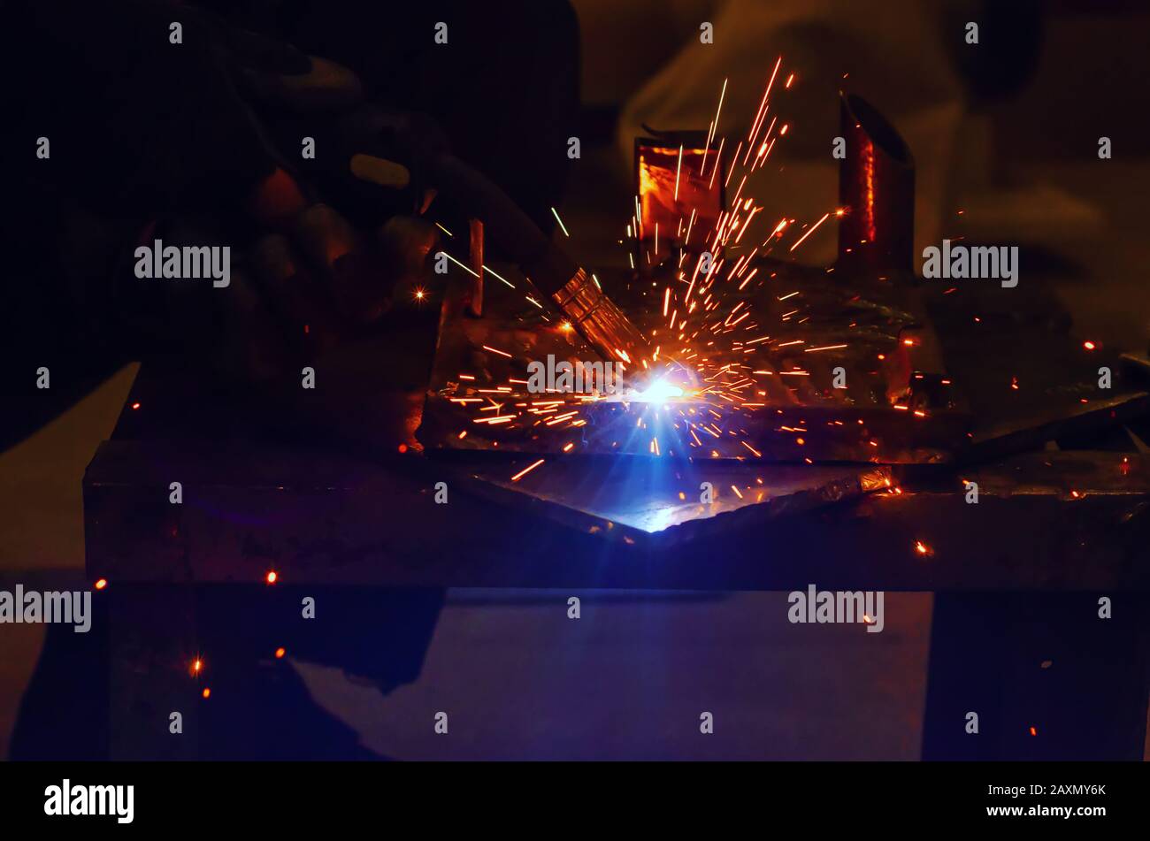 Metal welding in a metal workshop. Clear light, blue tinting Stock ...