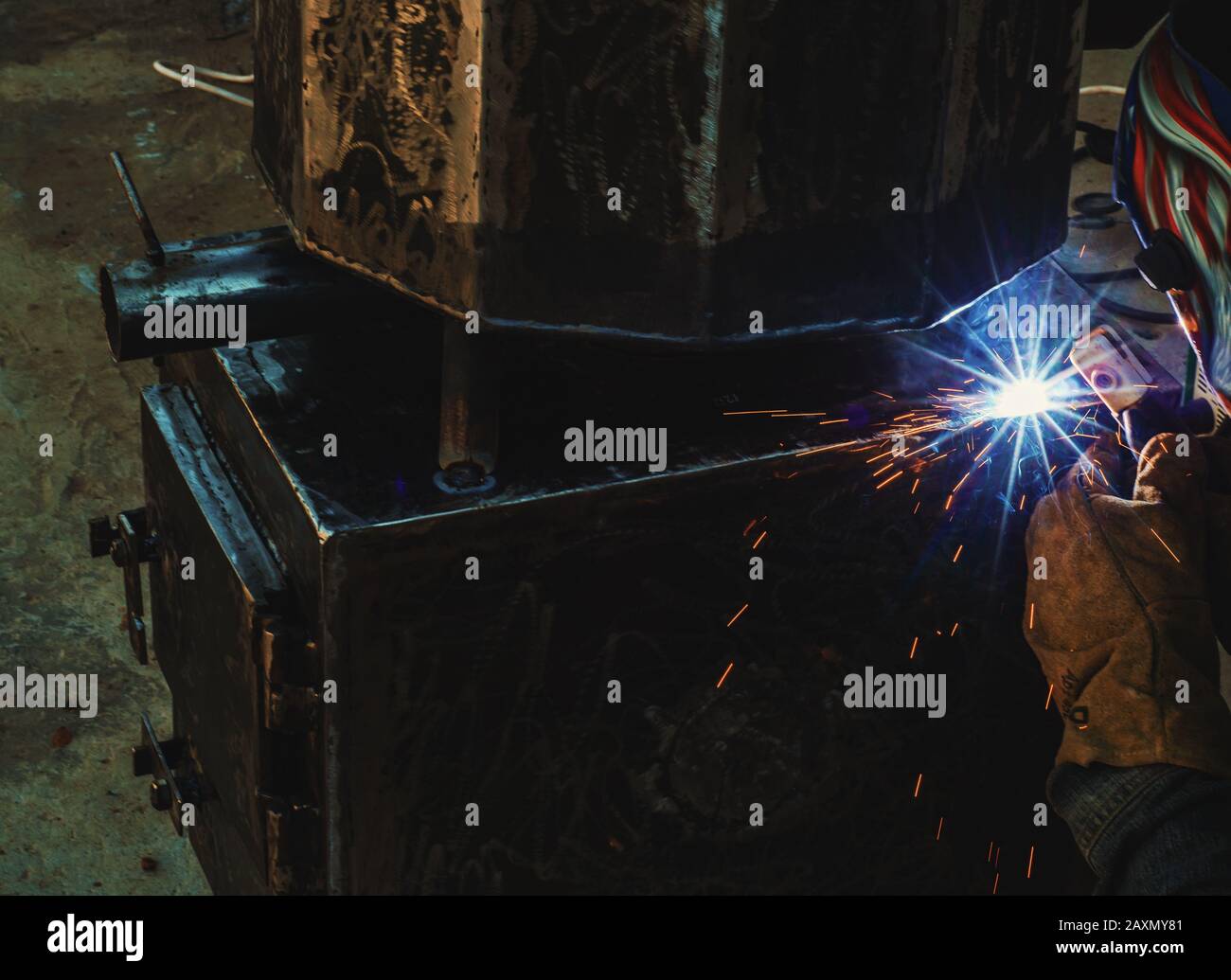 Spot welding of a metal product in a locksmith workshop Stock Photo - Alamy