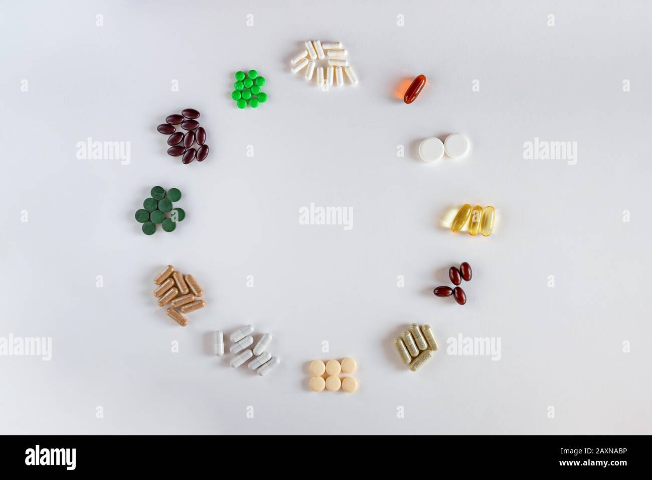 Medication with different types and colours as clock face isolated on ...