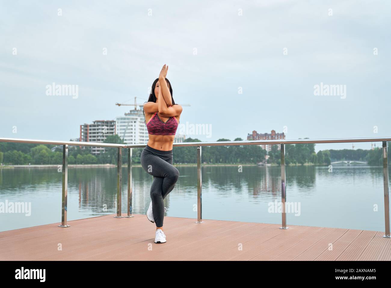 Full length portrait of healthy woman with strong body wearing sport ...