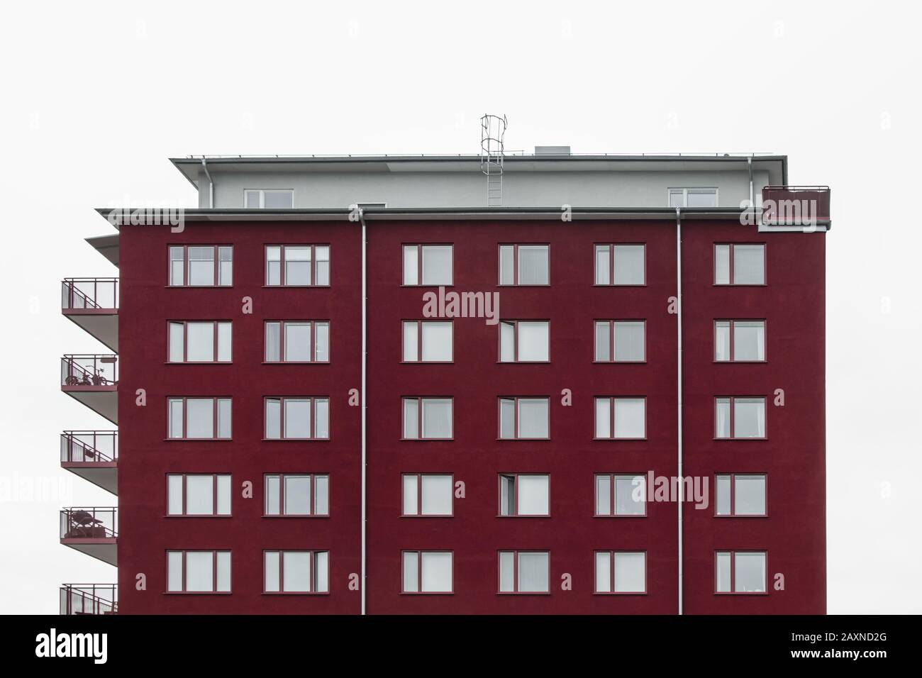 Modern cherry red building against cloudy sky. Stockholm, Sweden Stock ...