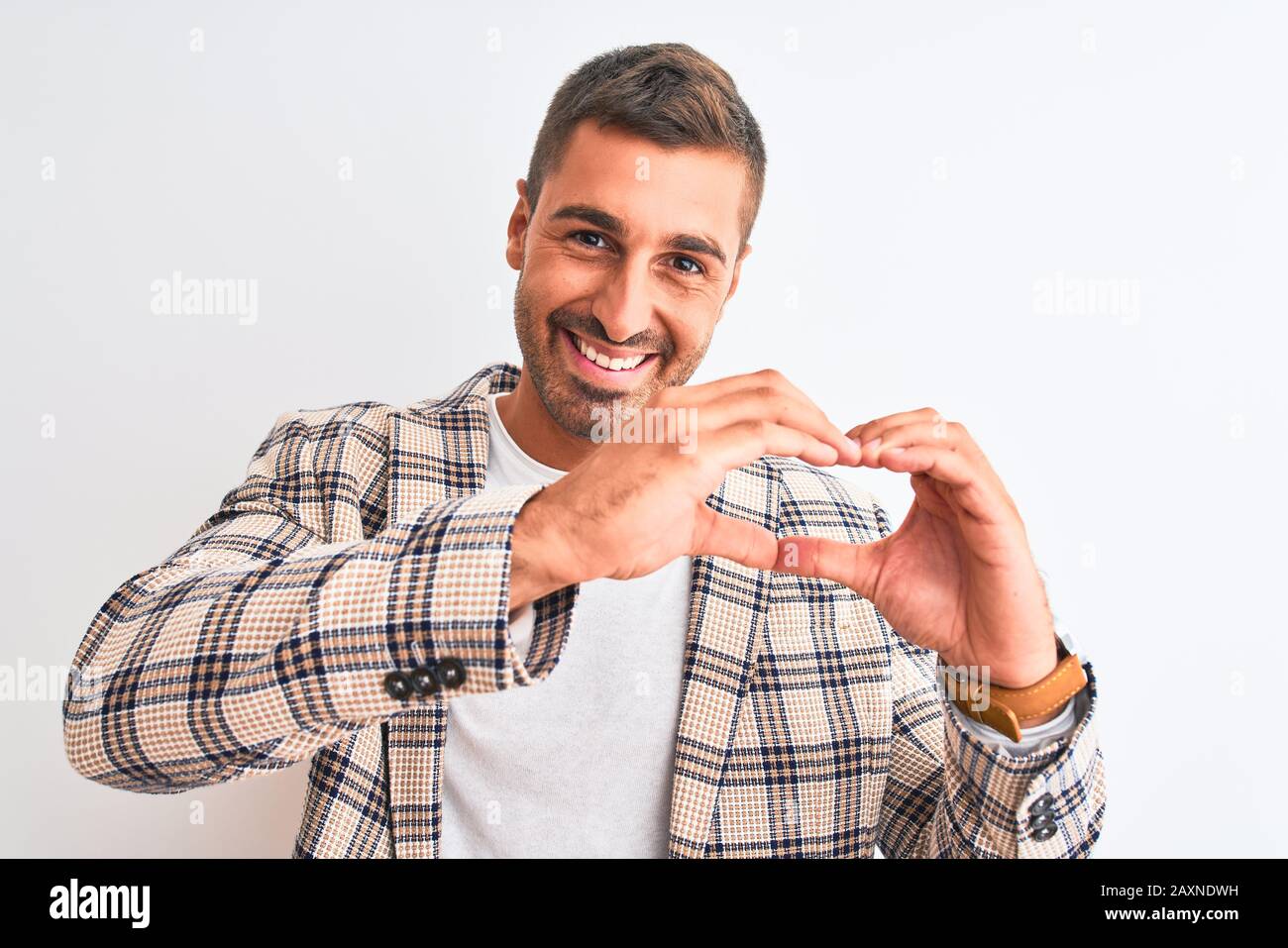 Young handsome business man wearing elegant jacket over isolated ...