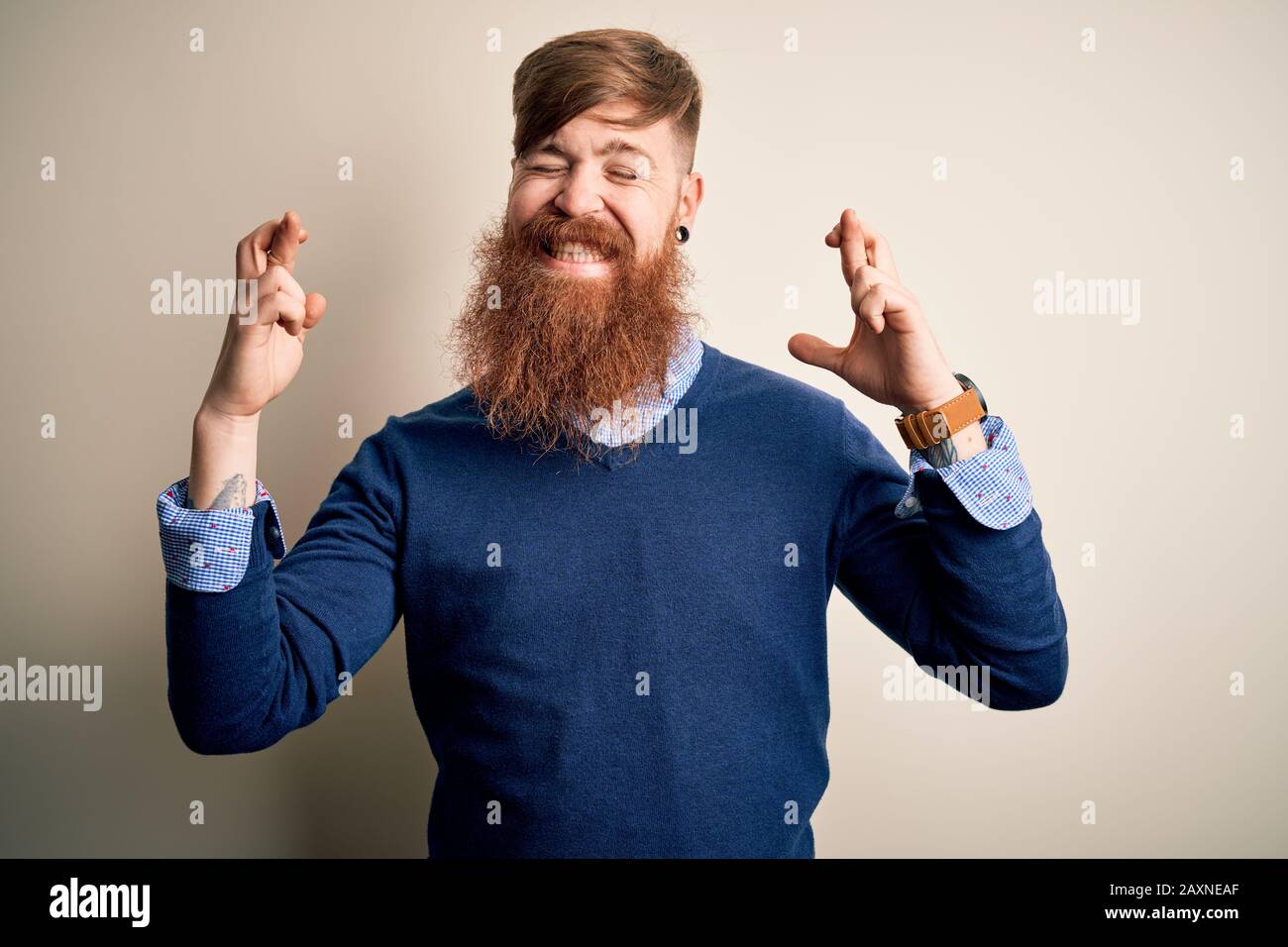 Handsome Irish redhead business man with beard standing over isolated ...