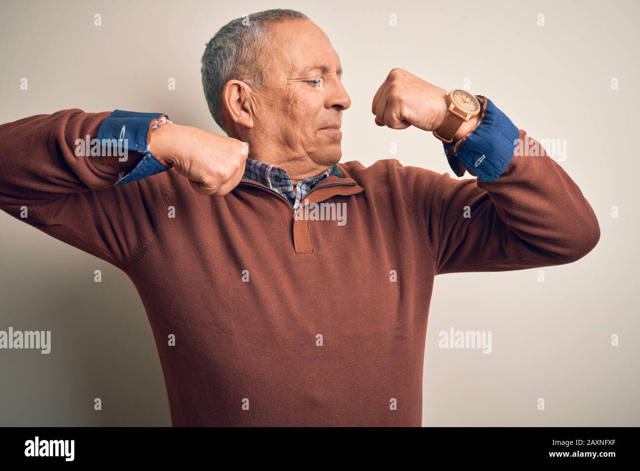 Senior handsome man wearing elegant sweater standing over isolated ...