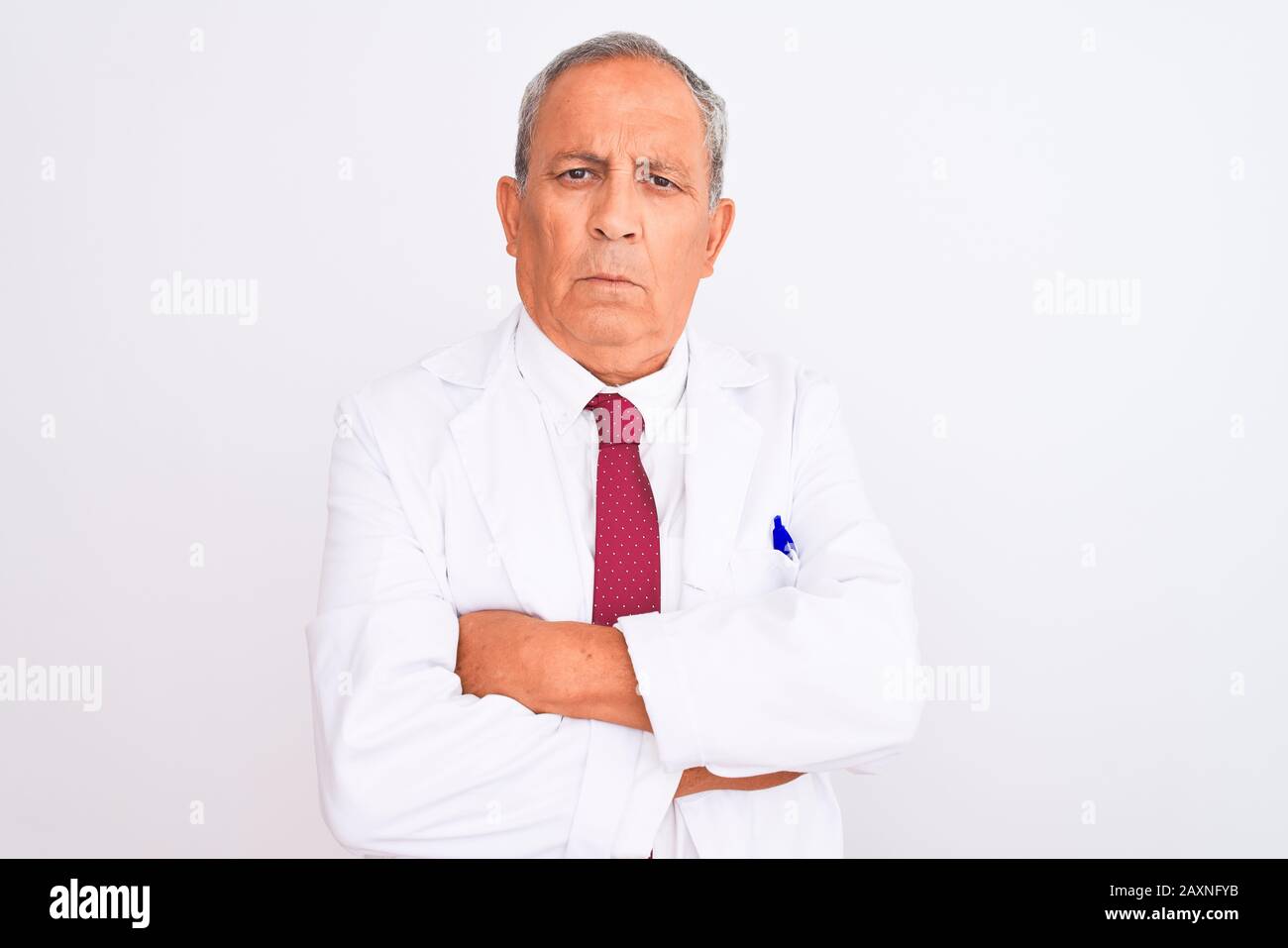 Senior grey-haired scientist man wearing coat standing over isolated ...