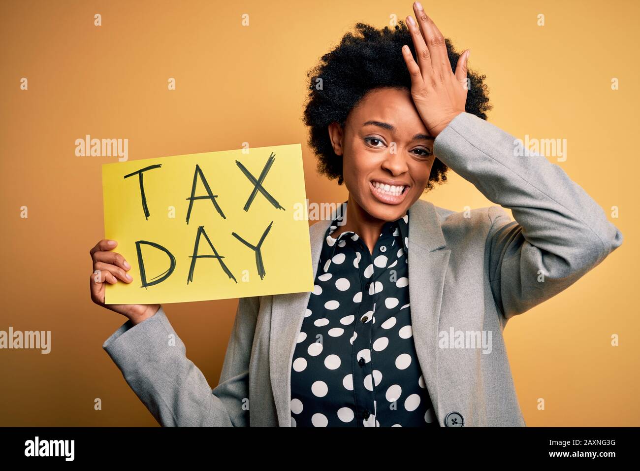 Young African American afro woman with curly hair holding paper with ...