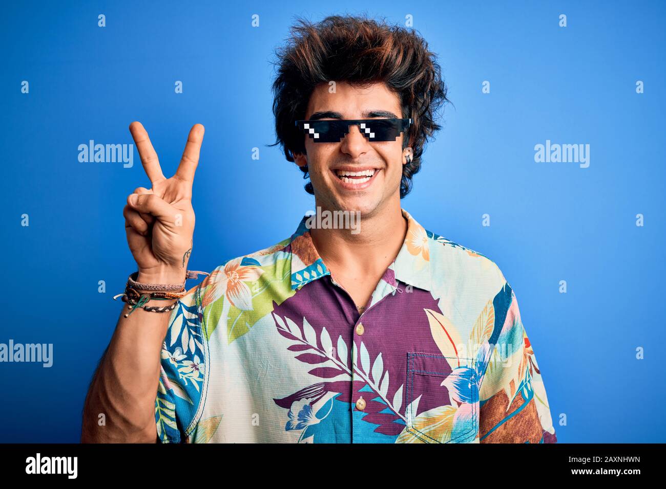 Young handsome man wearing thug life glasses standing over isolated ...