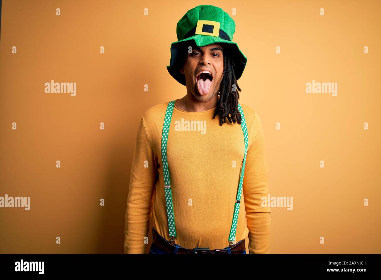 Young african american man wearing green hat celebrating saint patricks ...