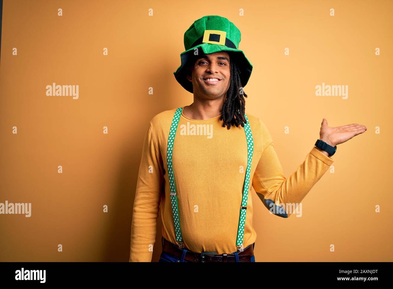 Young african american man wearing green hat celebrating saint patricks ...